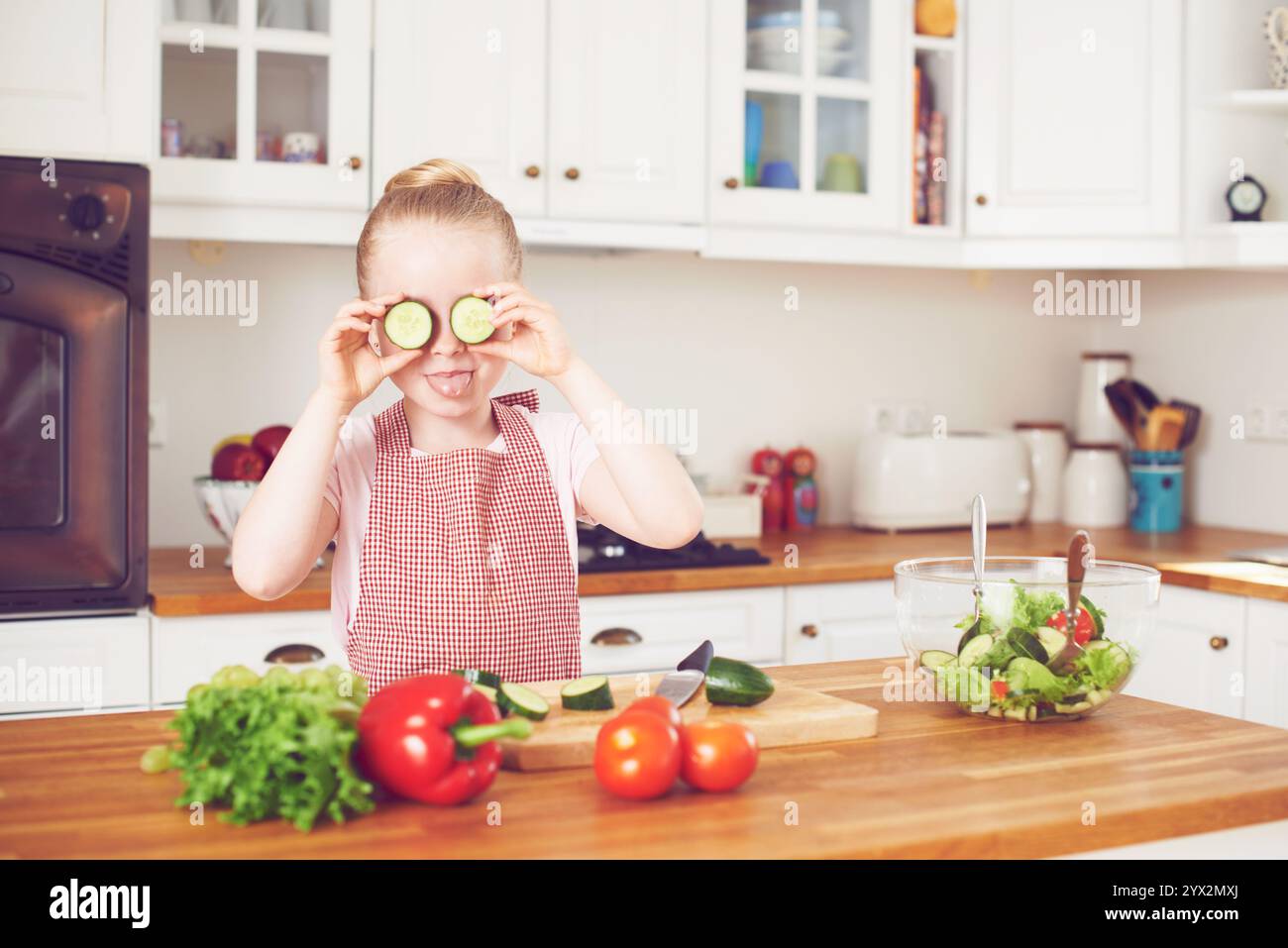 Vegetables, cucumber on eyes and silly kid in kitchen for healthy ...