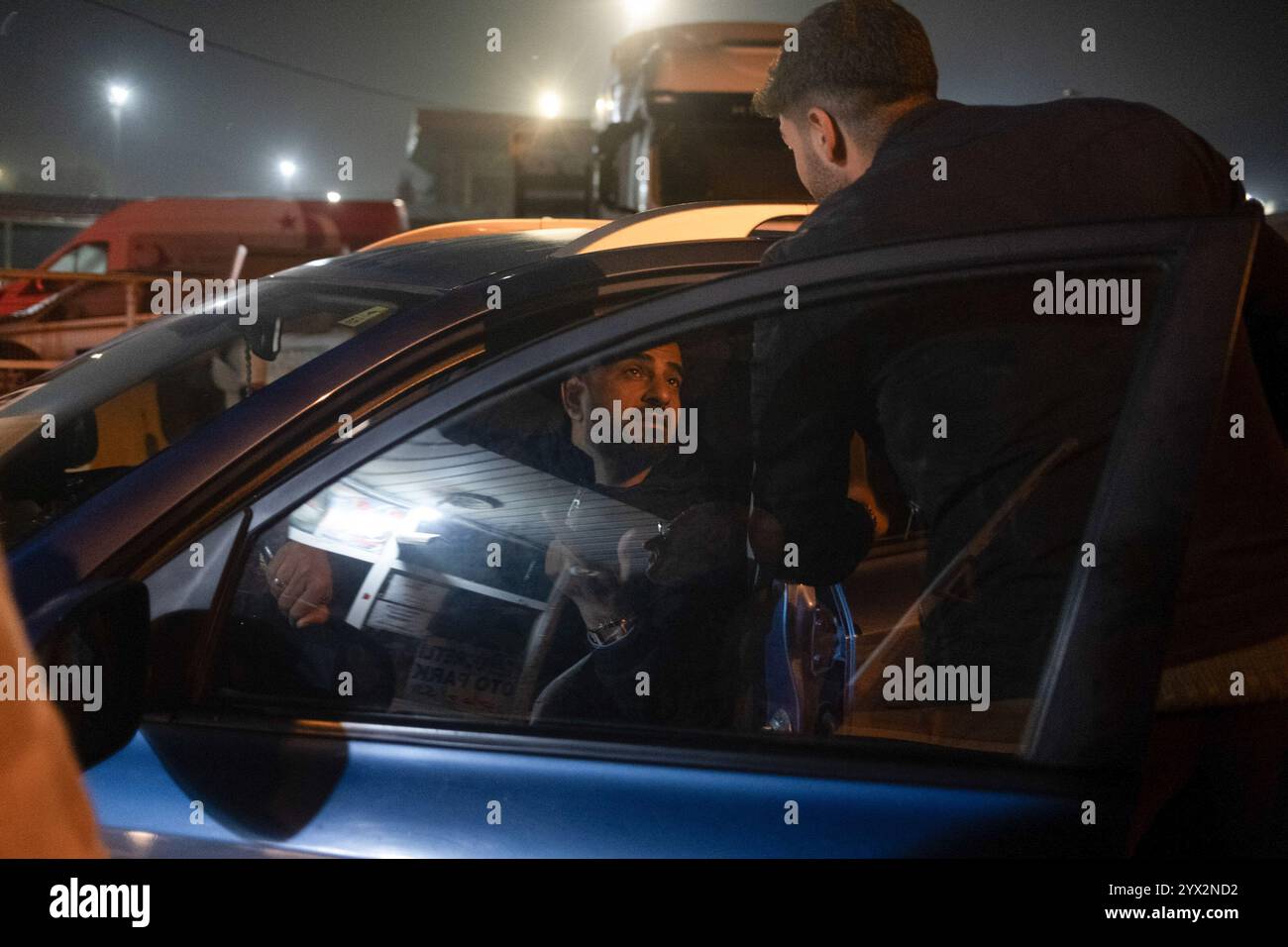 A Syrian man drives his car to cross the border. On December 8, 2024 ...