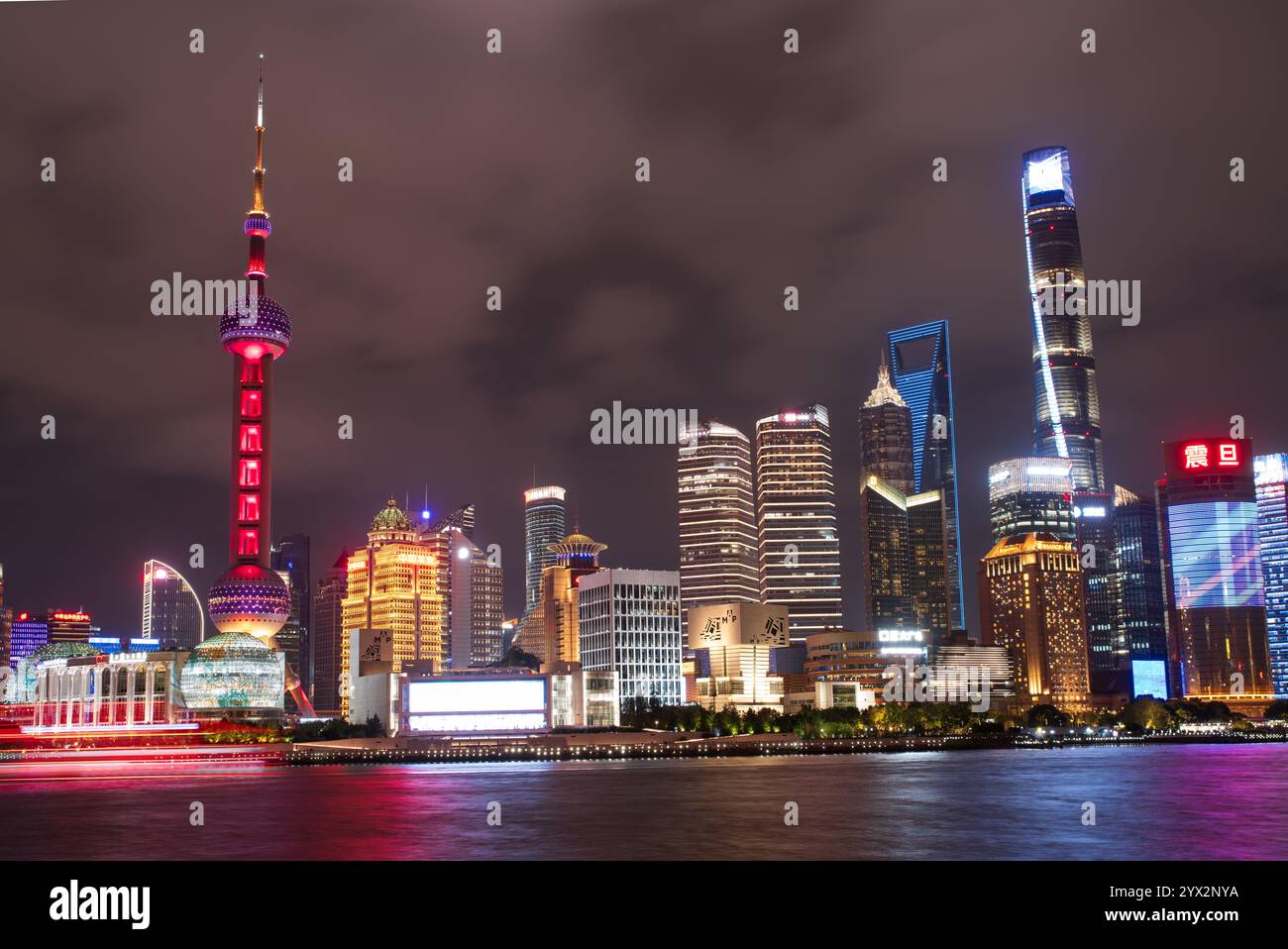 Shanghai's iconic skyline featuring the Oriental Pearl Tower at night ...