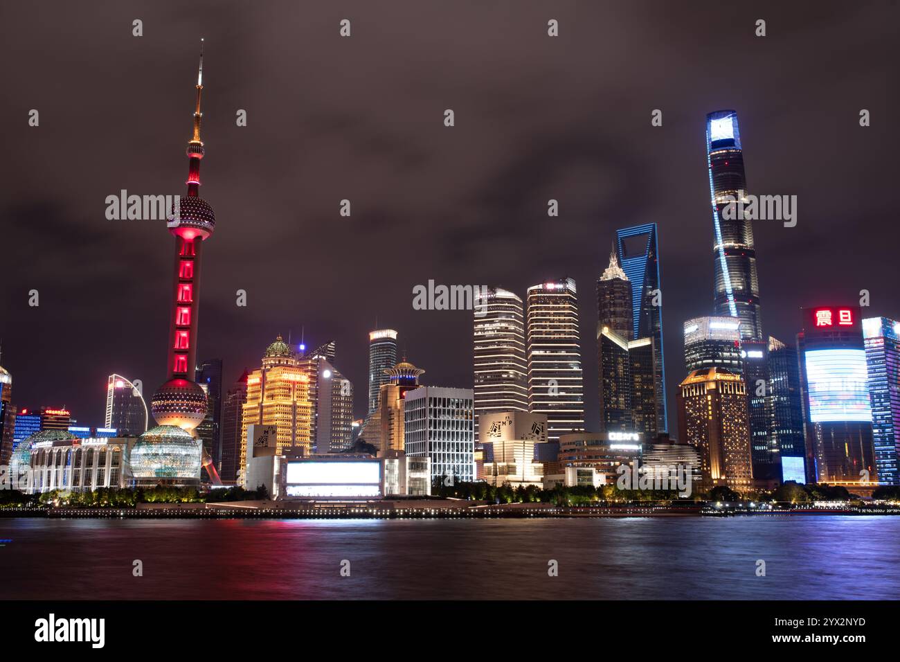 Shanghai's iconic skyline featuring the Oriental Pearl Tower at night ...