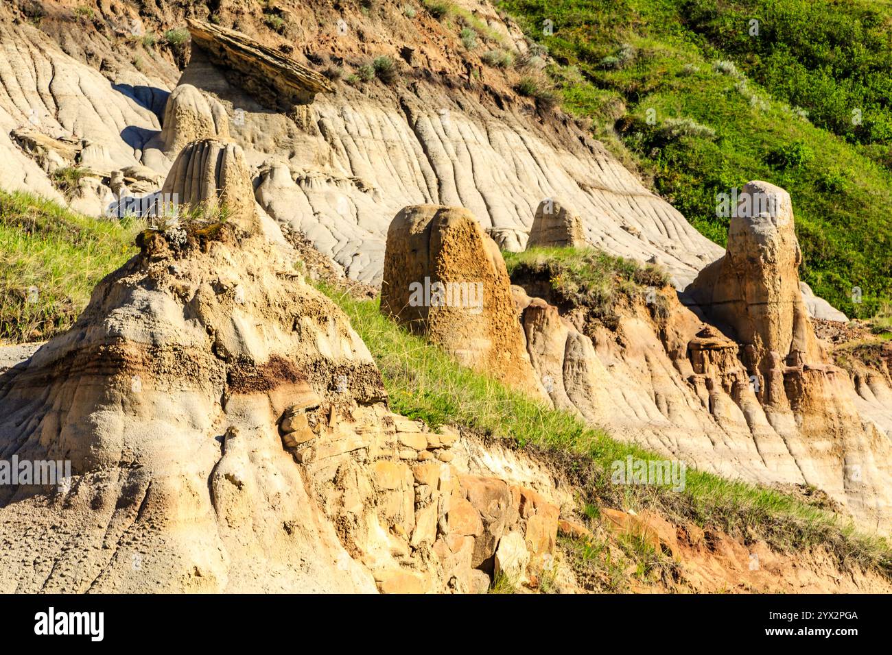 A rocky hillside with a few small hills and a few large rocks. The ...