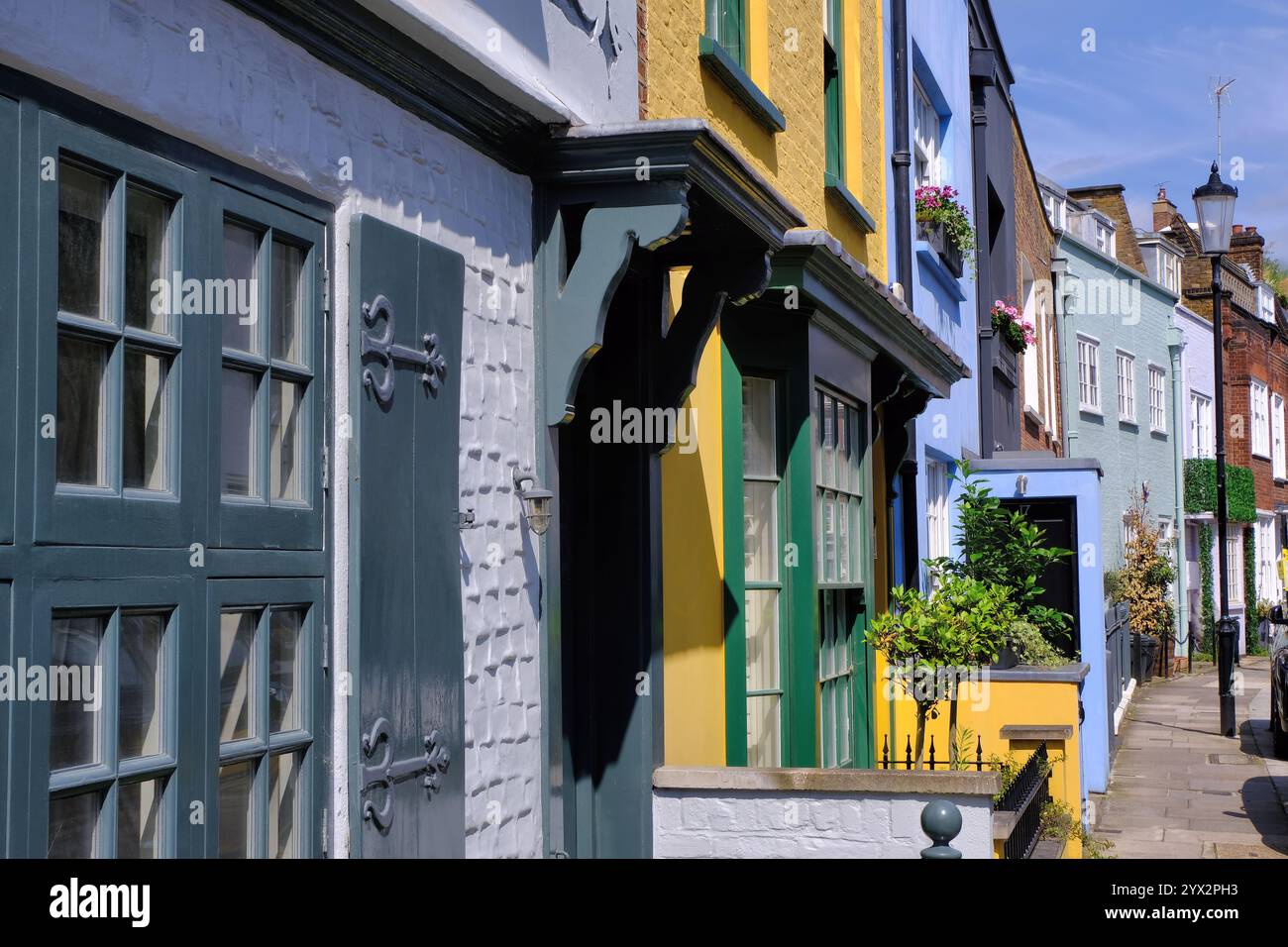 Colourful painted terrace houses and old lamp post in Godfrey Street ...