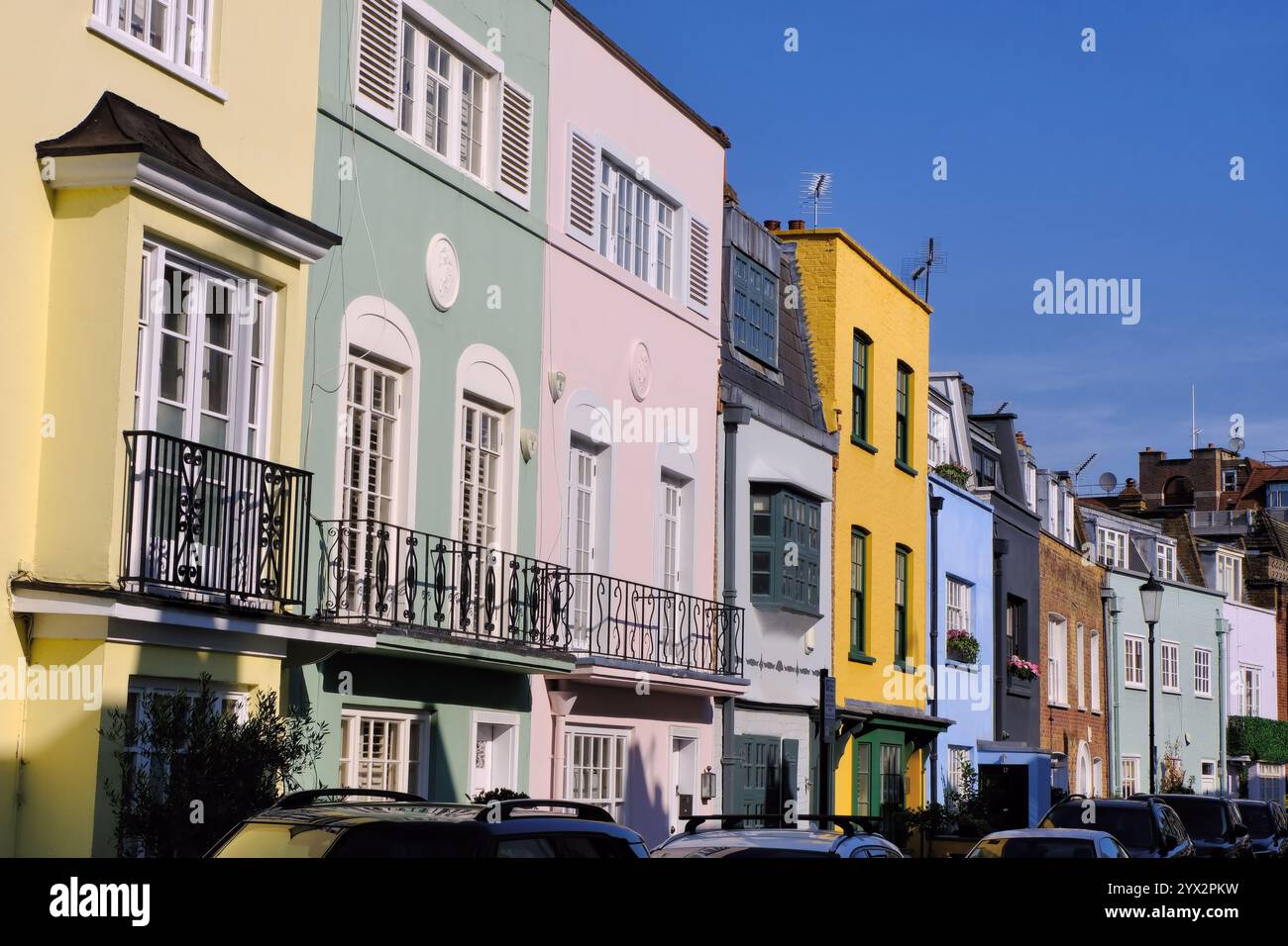 Colourful painted terrace houses and old lamp post in Godfrey Street ...