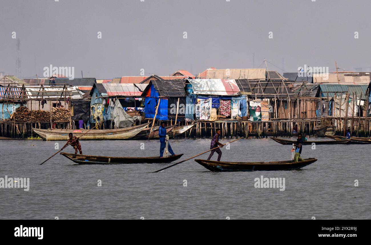 Lagos, Nigeria. 12th Dec, 2024. Fishing boats sail on the water in ...