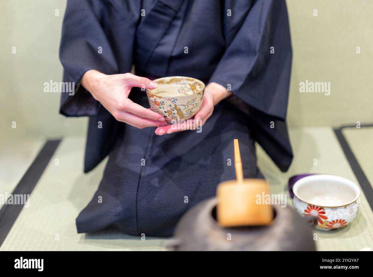 People preparing for tea ceremony at traditional Japanese house (ryokan ...