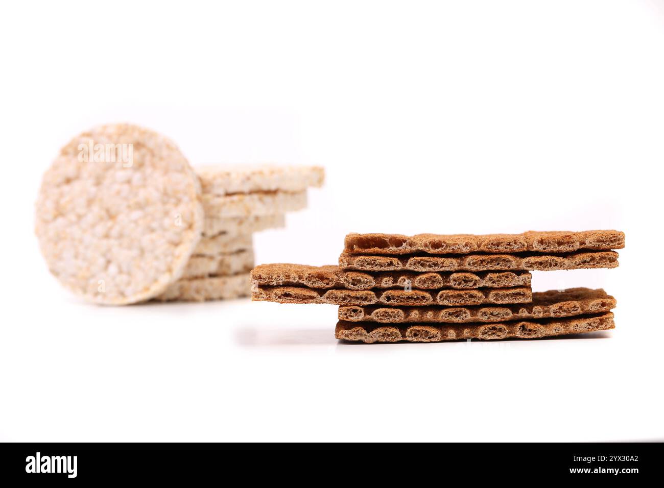 Composition of corn cracker and bread crisps. White background Stock ...