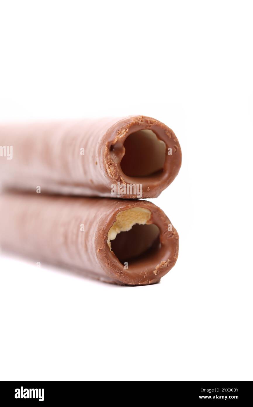 Waffle rolls coated chocolate. Close up. White background Stock Photo ...