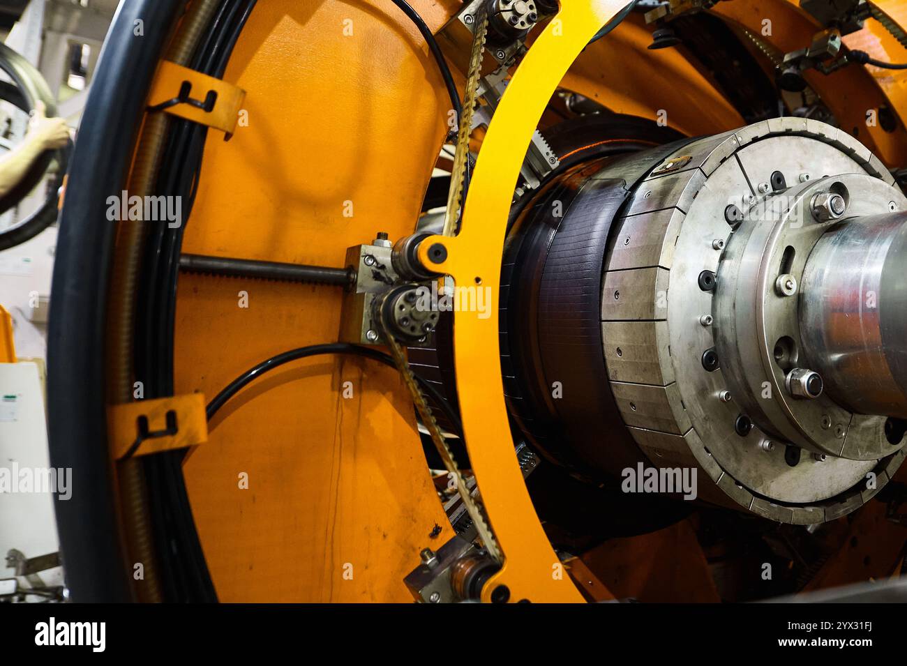 Steel shaft and rolling drum at tire production factory Stock Photo - Alamy