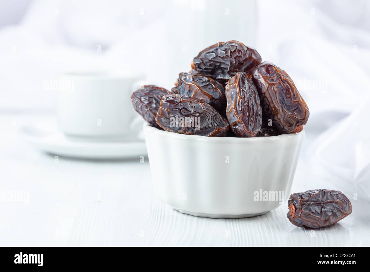 Dried medjool dates on a white kitchen table Stock Photo - Alamy