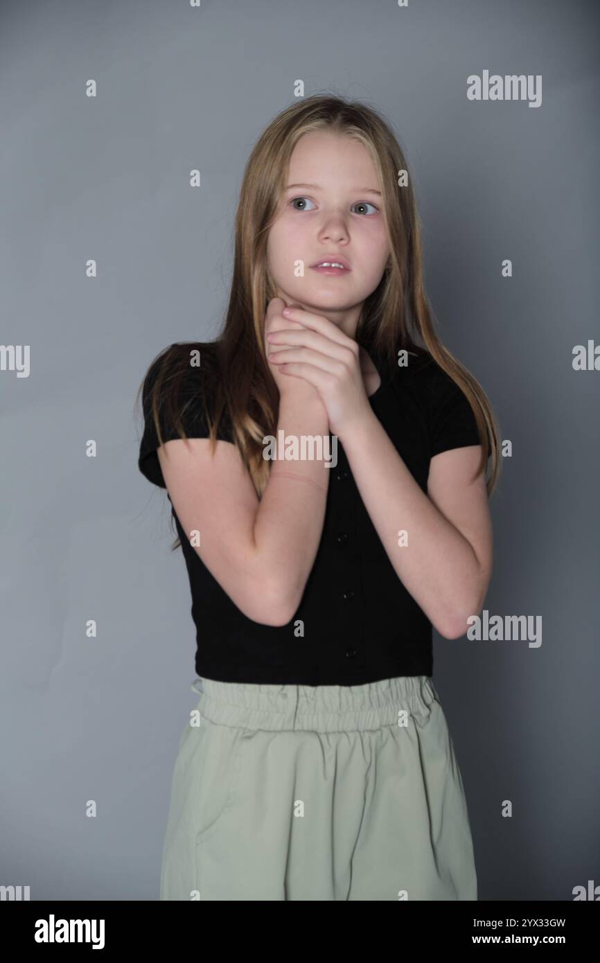 Young dreamer holds a reflective pose, lost in thought. Showcases the profound inner world of a ...