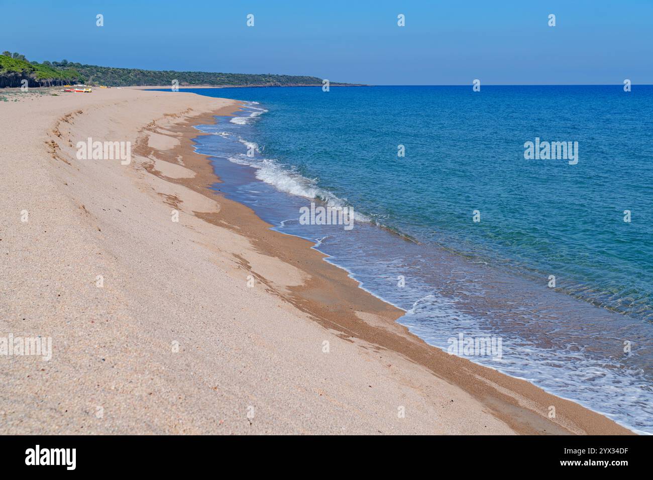 The beautiful color of the Sardinian sea right on the shore with a view ...