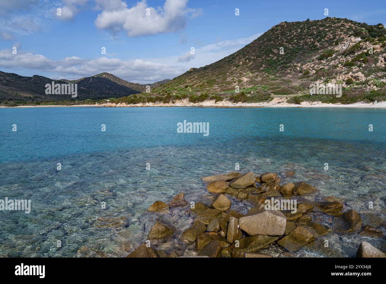 The beautiful color of the Sardinian sea right on the shore with a view ...