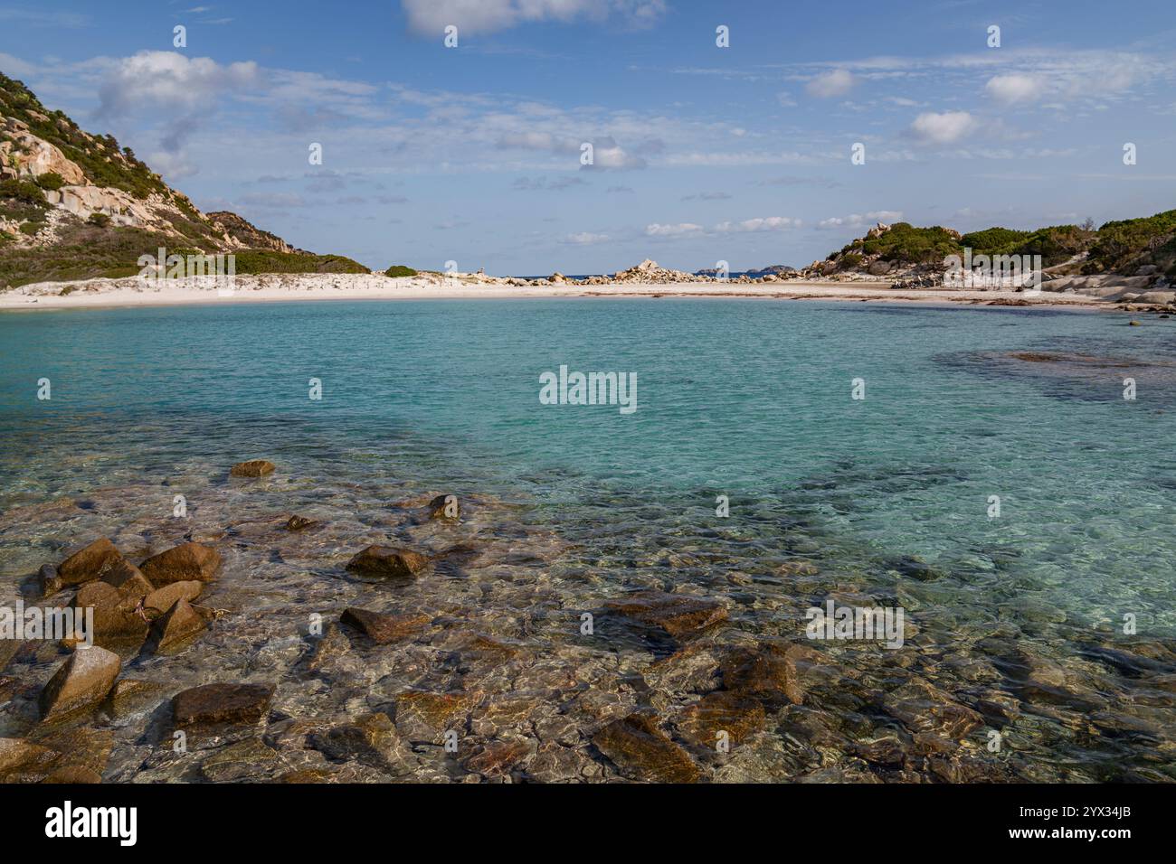 The beautiful color of the Sardinian sea right on the shore with a view ...