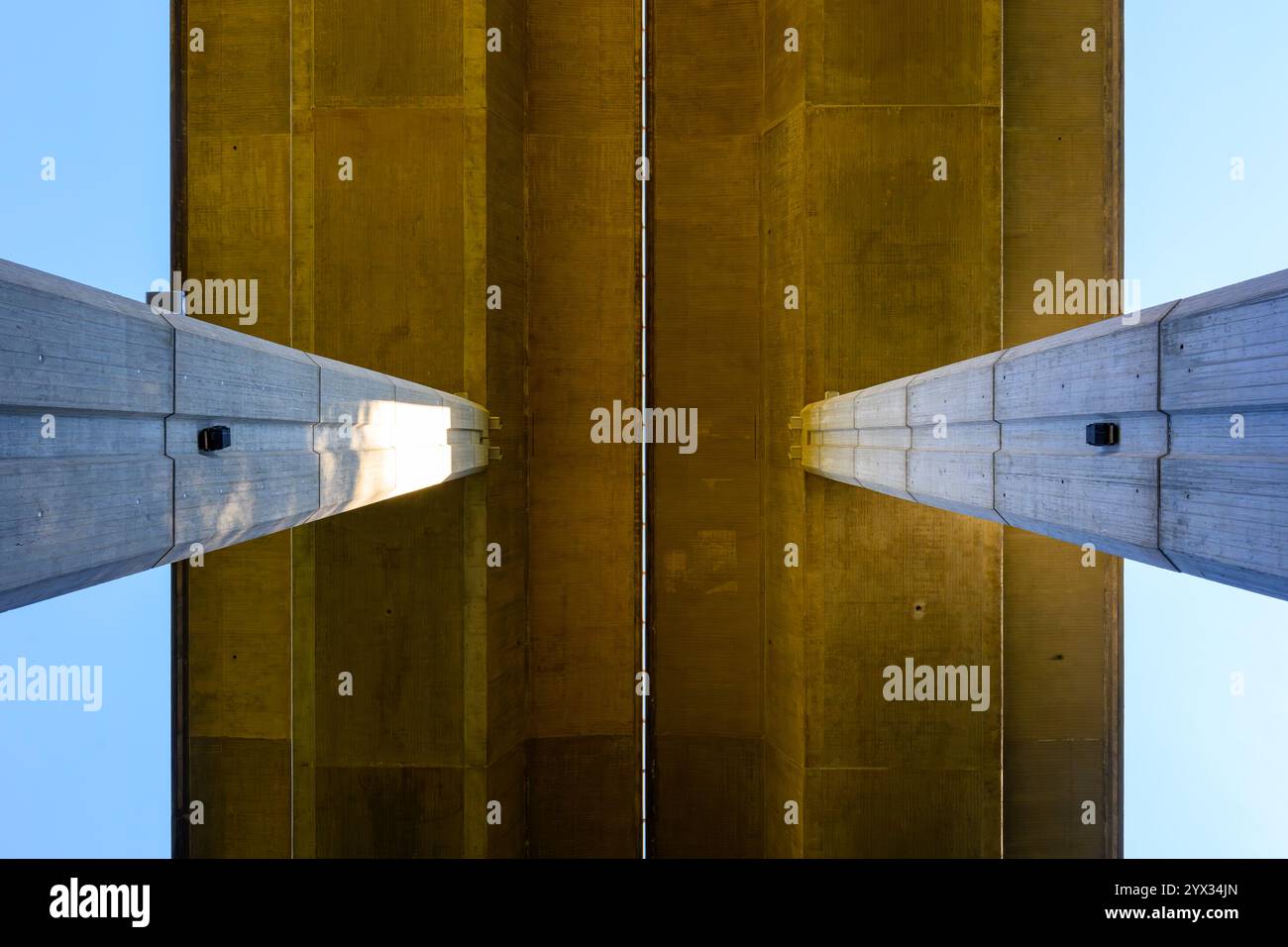 Outside a modern bridge made of concrete in gray pillars Stock Photo ...