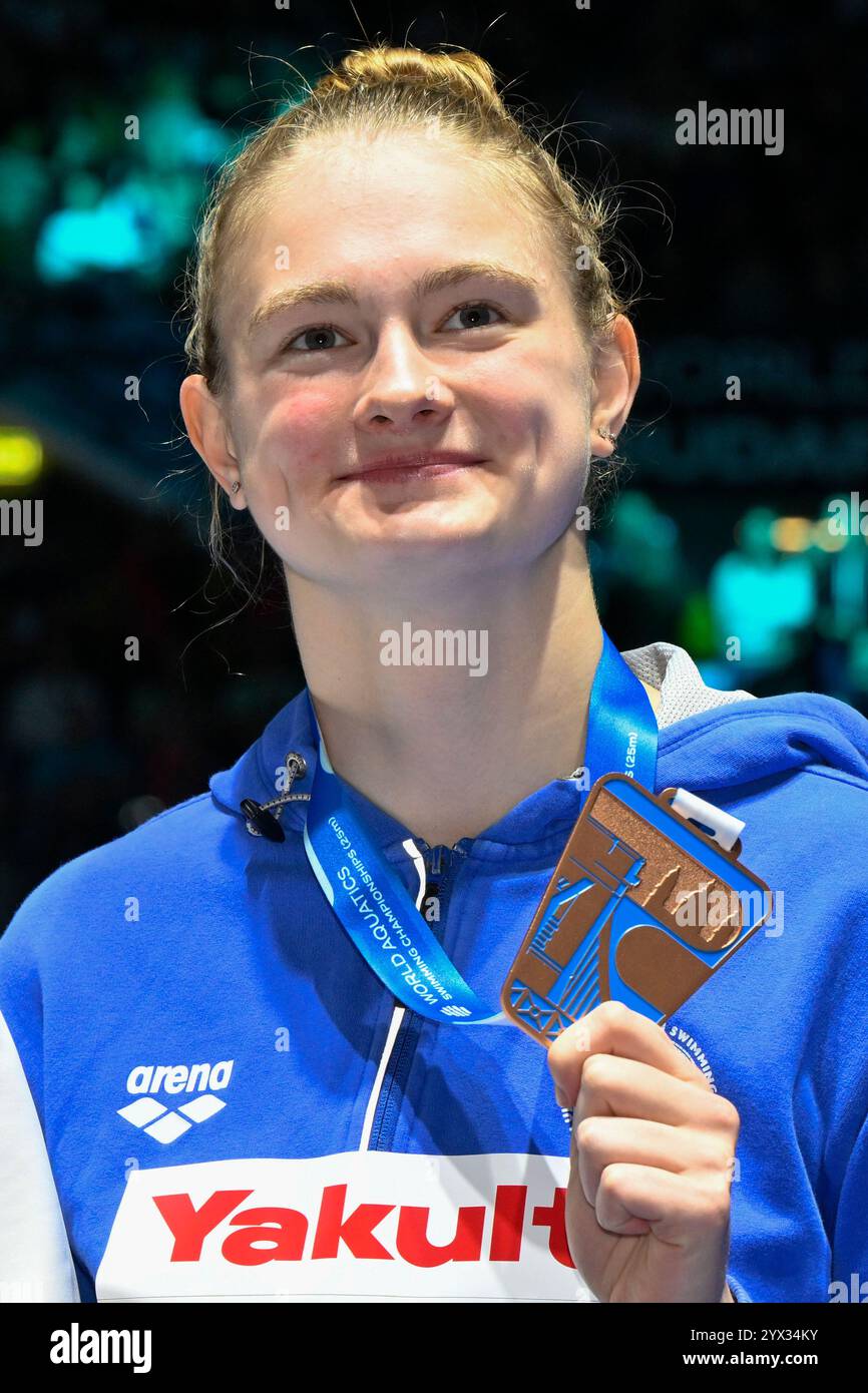 Eneli Jefimova of Estonia shows her bronze medal after competing in the ...