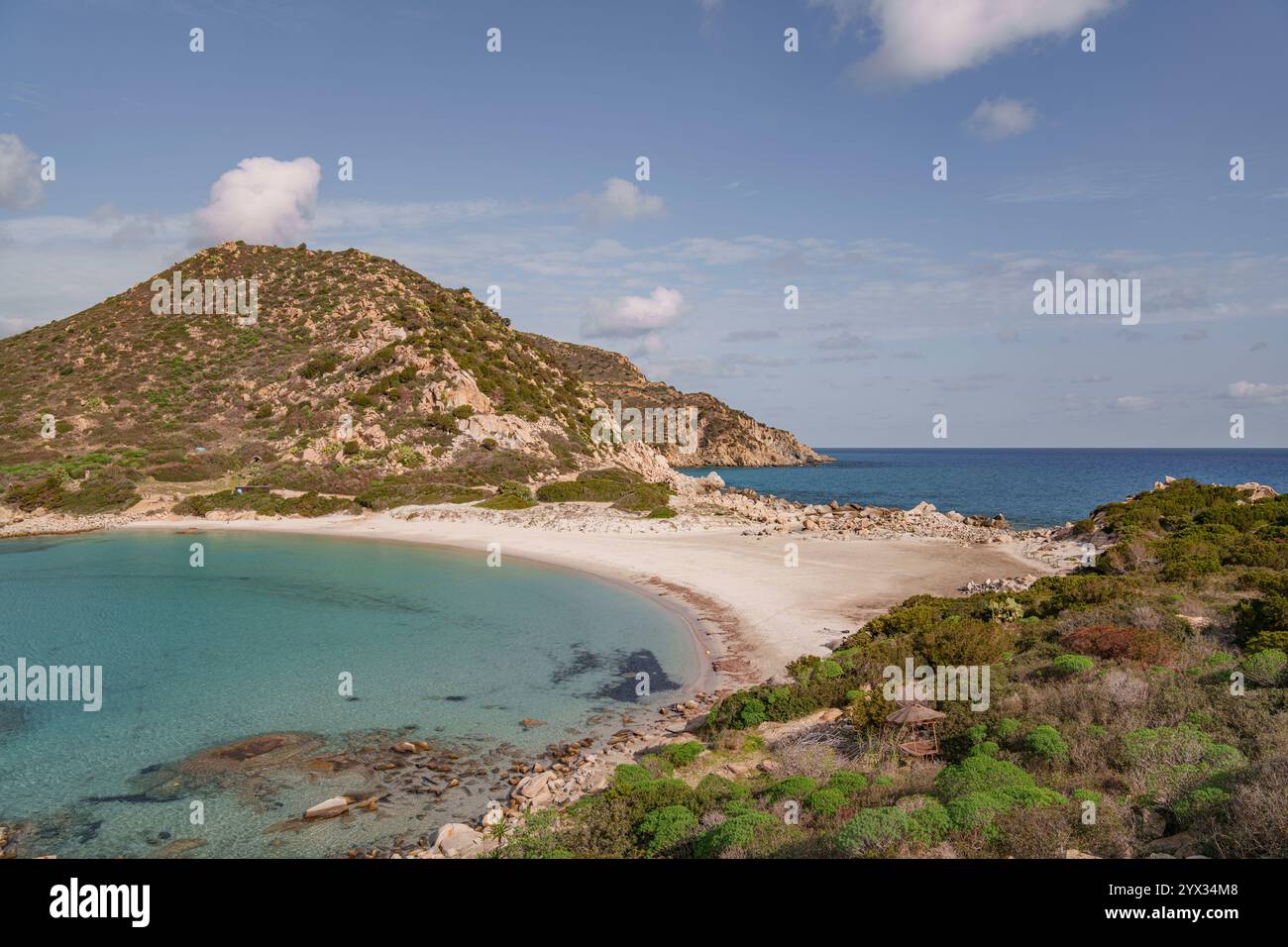 The beautiful color of the Sardinian sea right on the shore with a view ...
