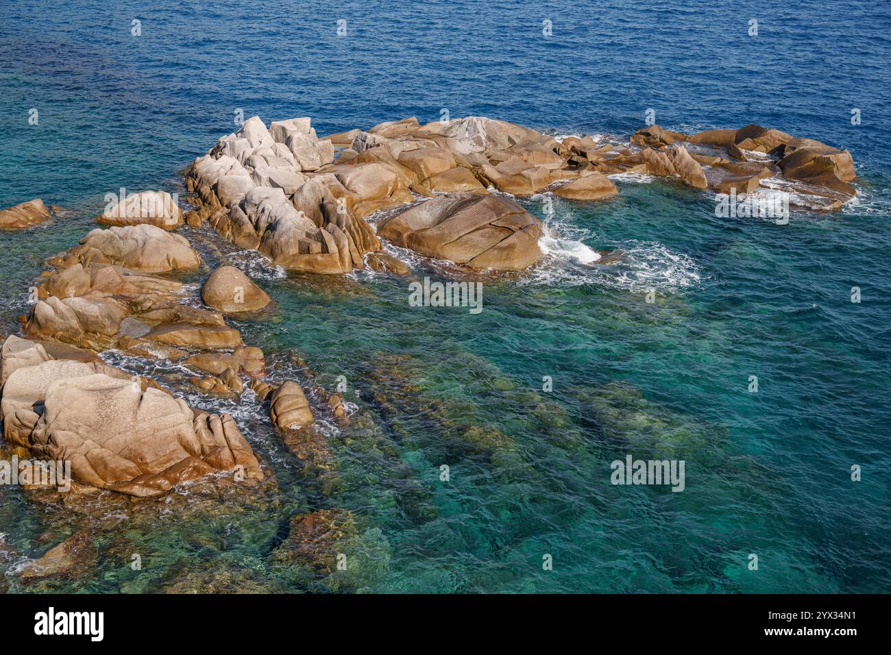 Rocky seaside with beautiful water color and amazing rock colors Stock ...
