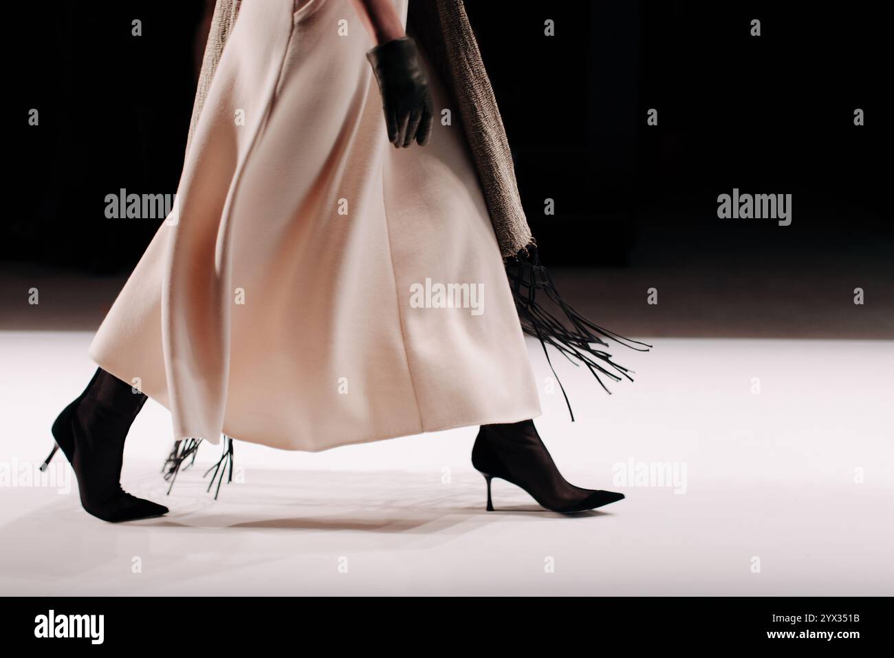 Elegant fashion details of warm long skirt, black gloves and high heels ...