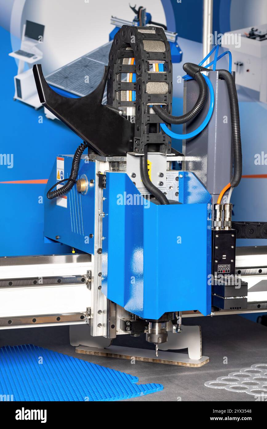 Advanced cutting machine at work in a modern manufacturing facility ...