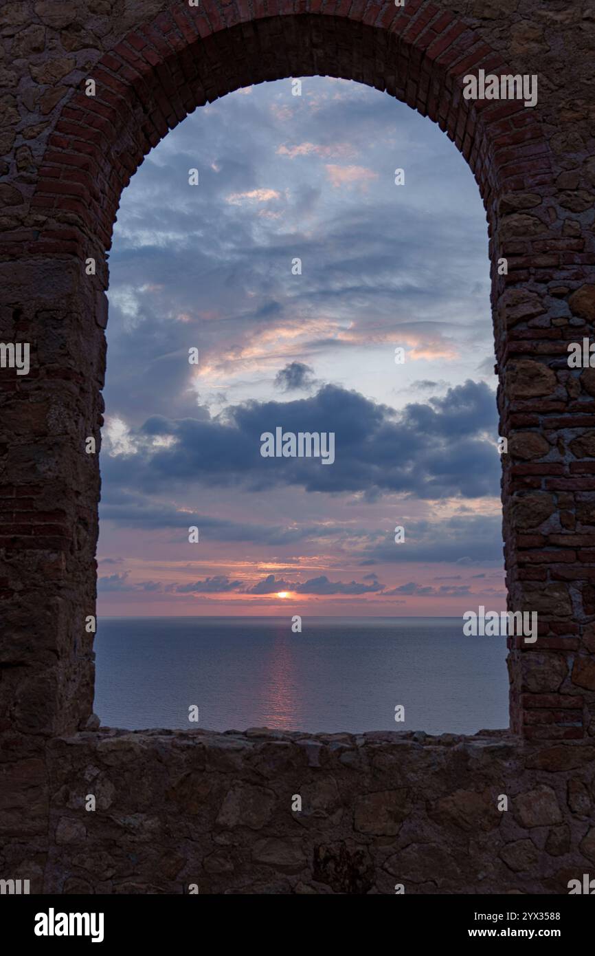 View through old brick windows to the sea at sunset Stock Photo - Alamy