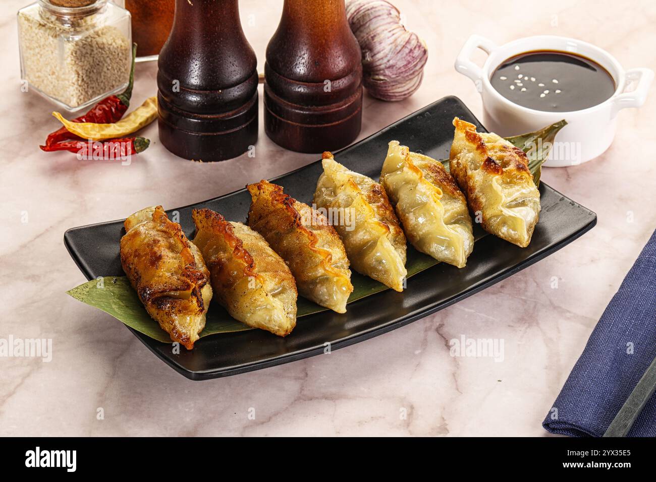 Fried Japanese stuffed dumplings - Gyoza with meat Stock Photo - Alamy