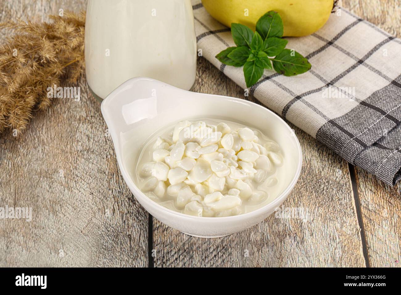 Grain cottage cheese with sour in the bowl Stock Photo - Alamy
