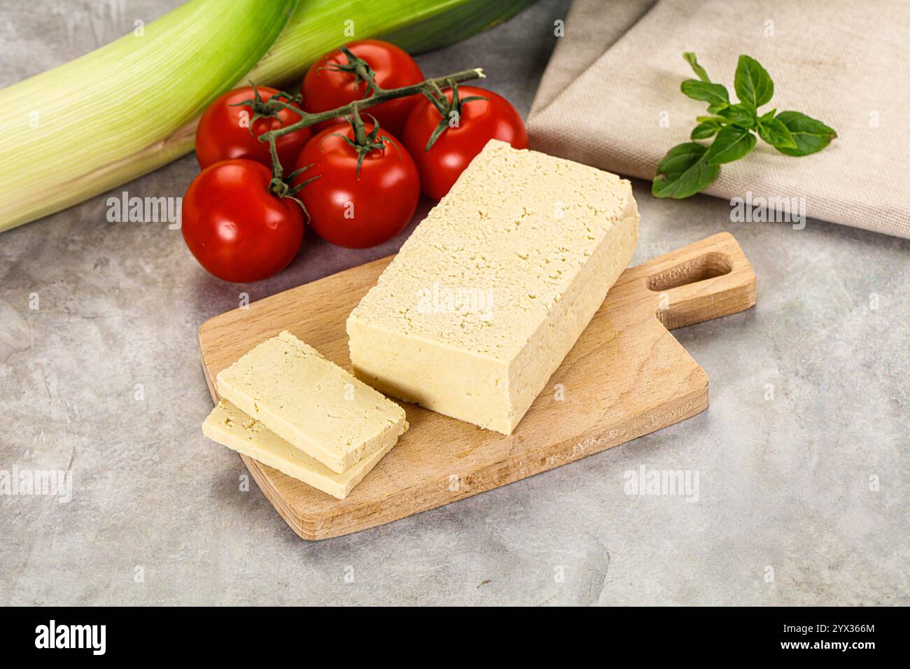 Soya vegan tofu cheese brick over board Stock Photo - Alamy