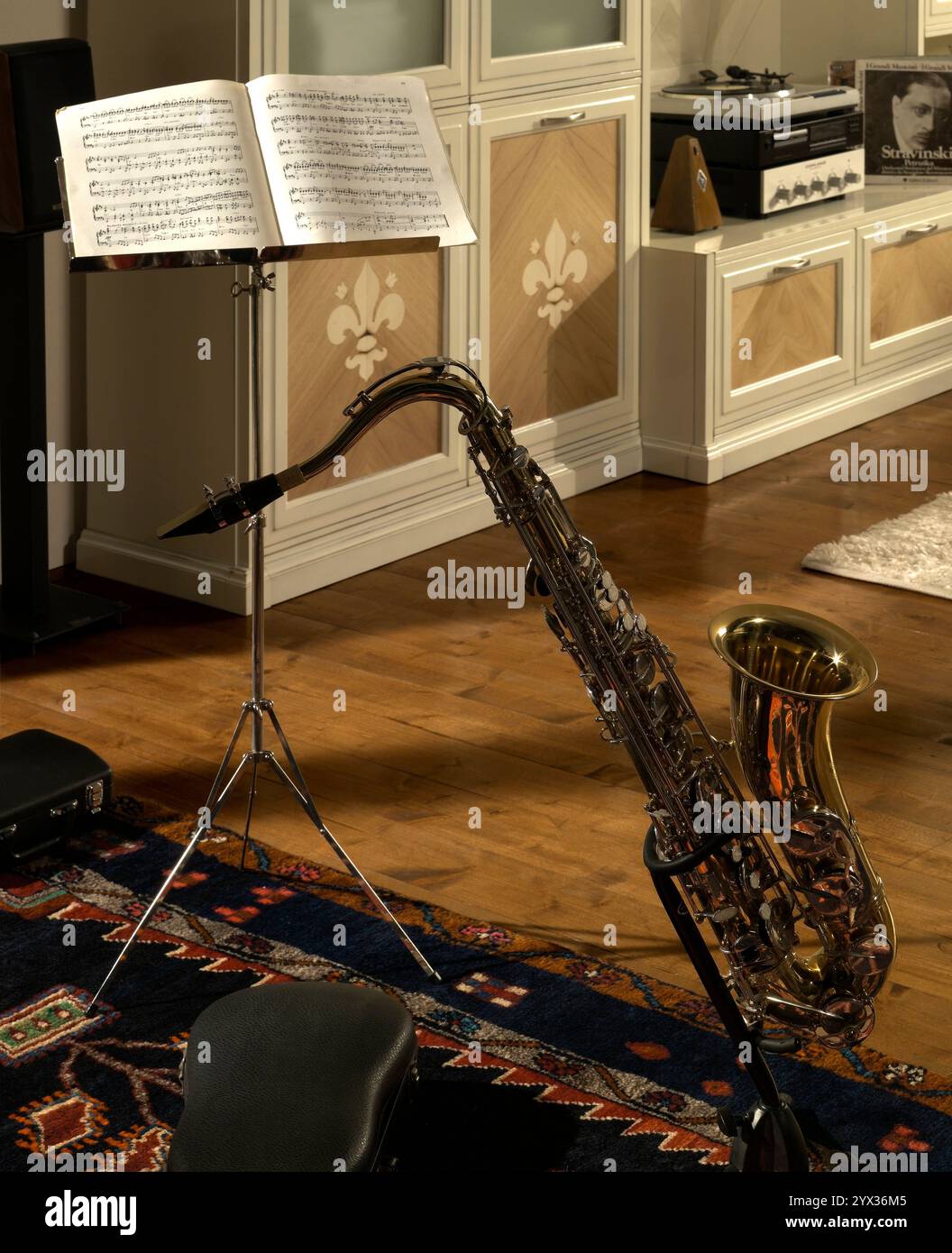 Interior of a room with saxophone and musical score Stock Photo - Alamy