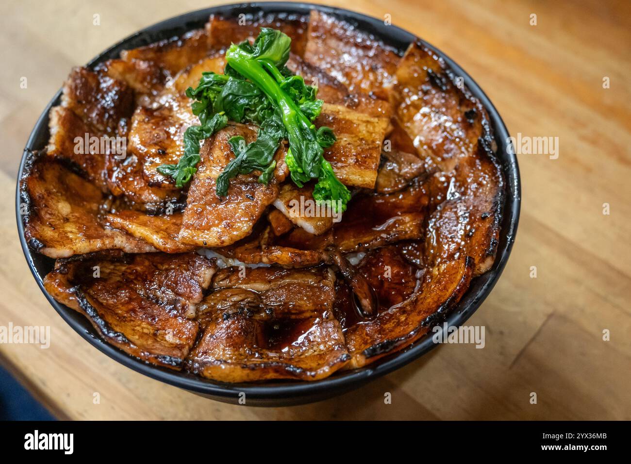 Japanese Buta Don Pork Rice Bowl with greens on top Stock Photo - Alamy