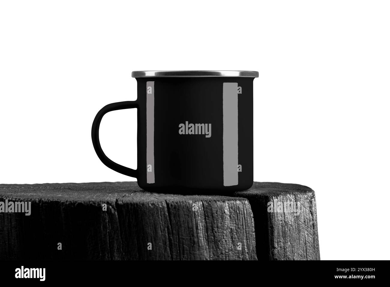 Mockup of black metal mug on the edge of burnt wooden beam, with silver ...