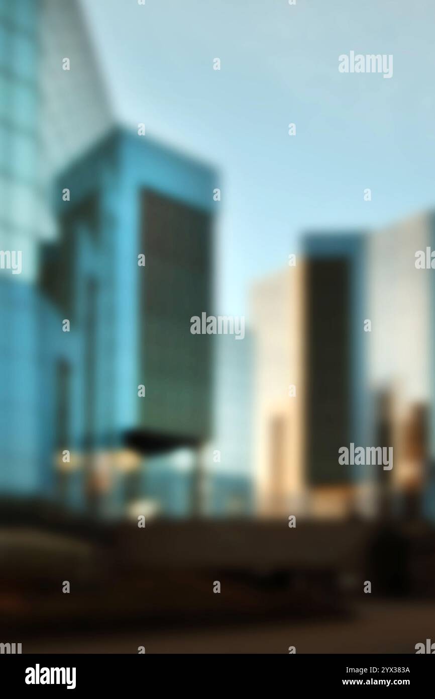 Modern office building with glass walls, blurred for use as a ...