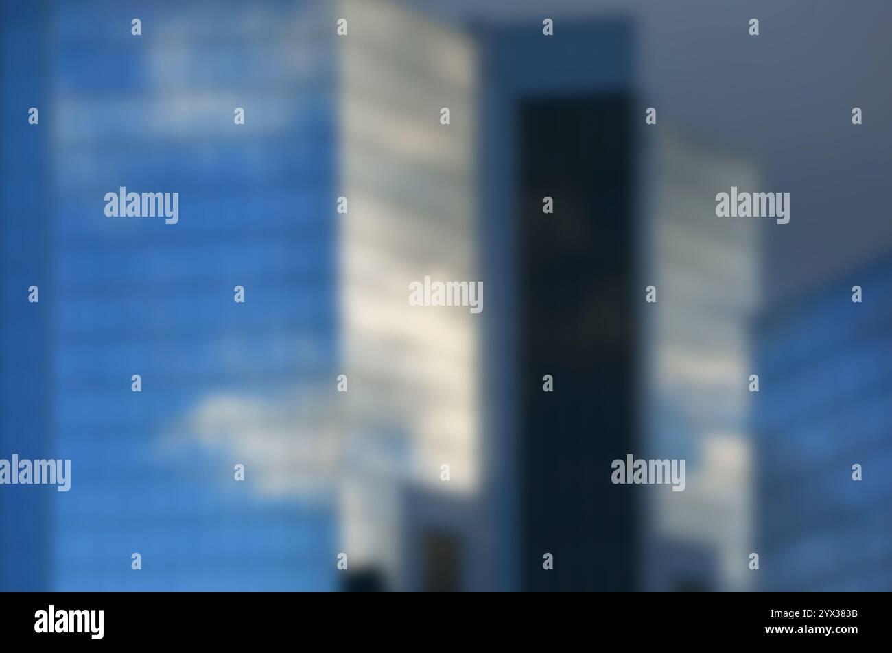 Modern office building with glass walls, blurred for use as a ...