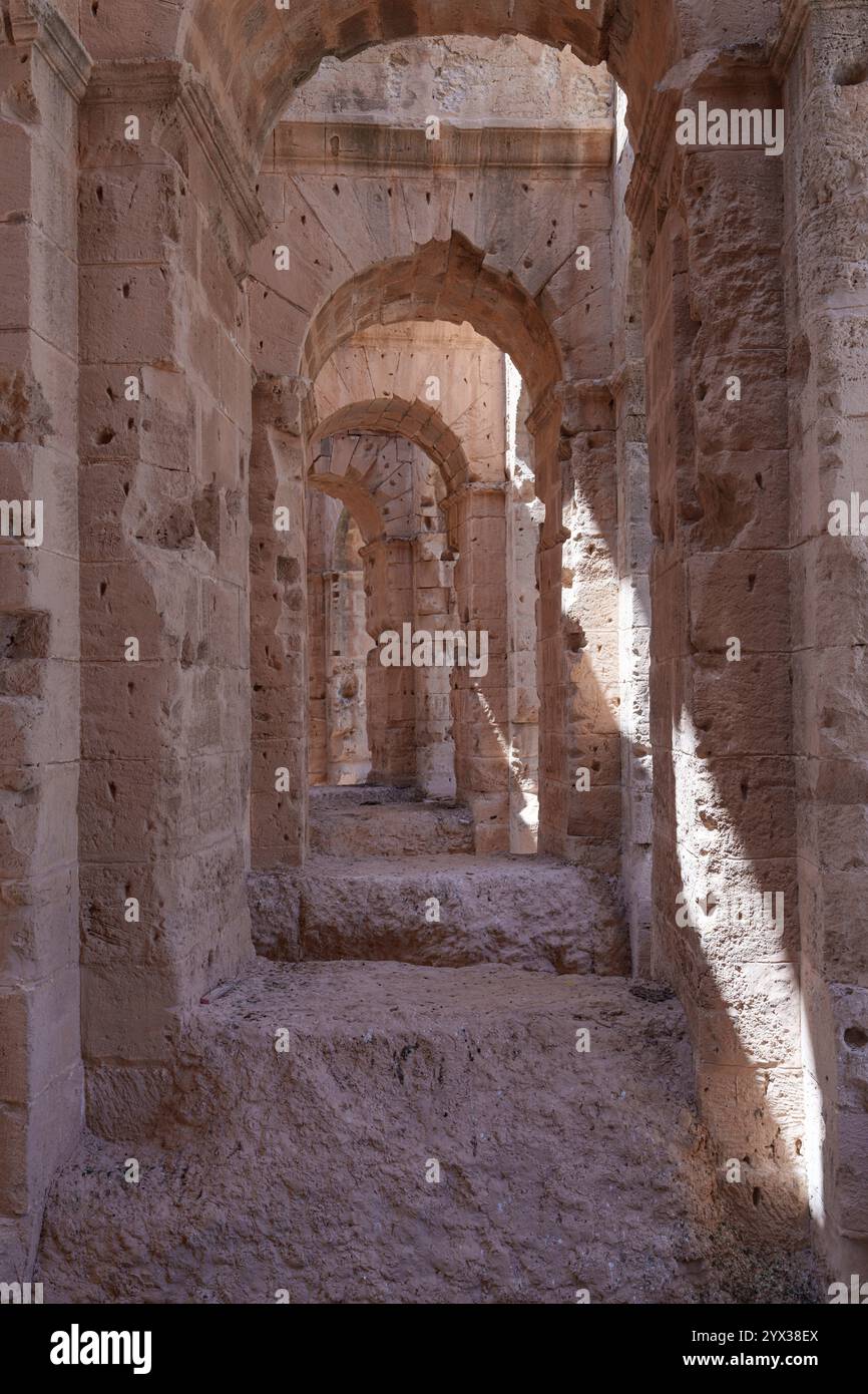 Old archaeological corridors and arcades made of stone bricks ...