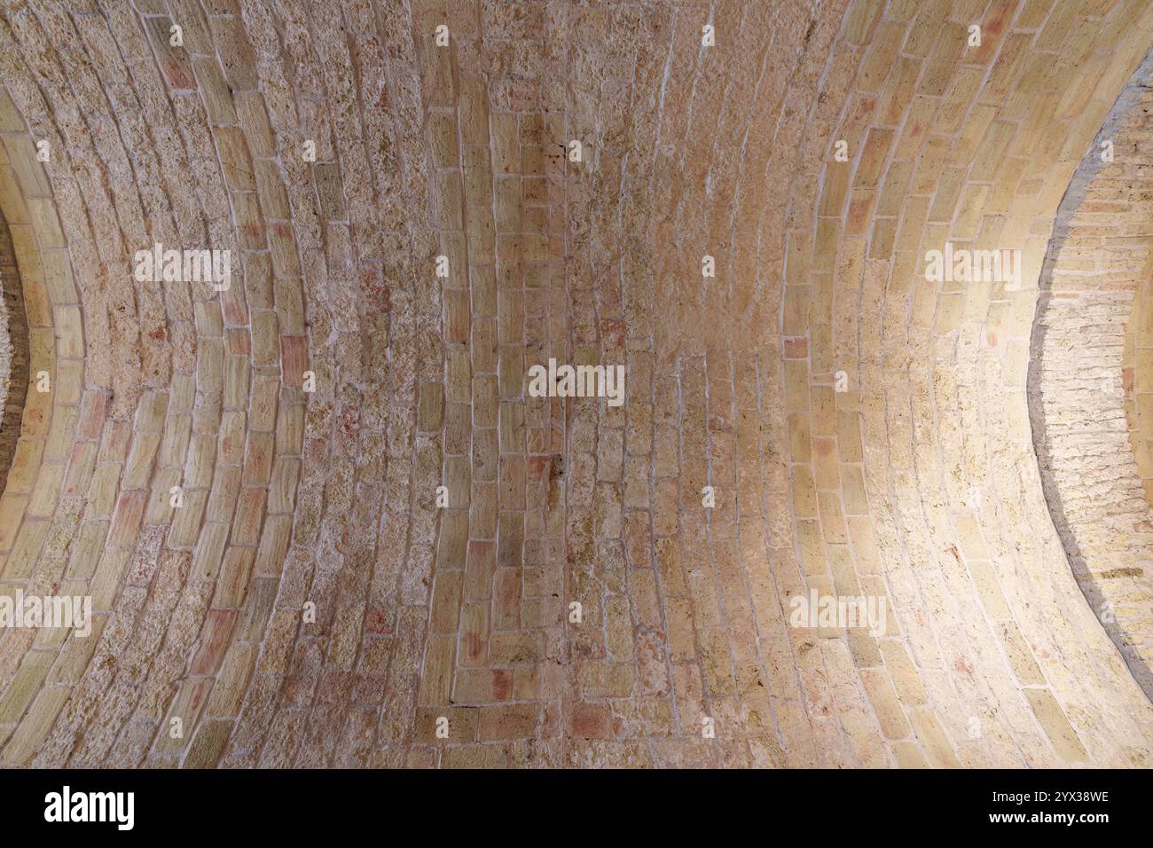 Beautiful arched vaults built of stone bricks creating symmetry Stock ...