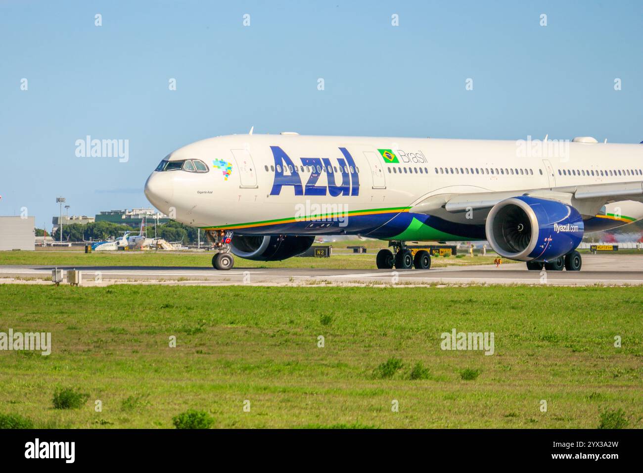 Modern passenger airplane taxiing on the runway at lisbon humberto ...