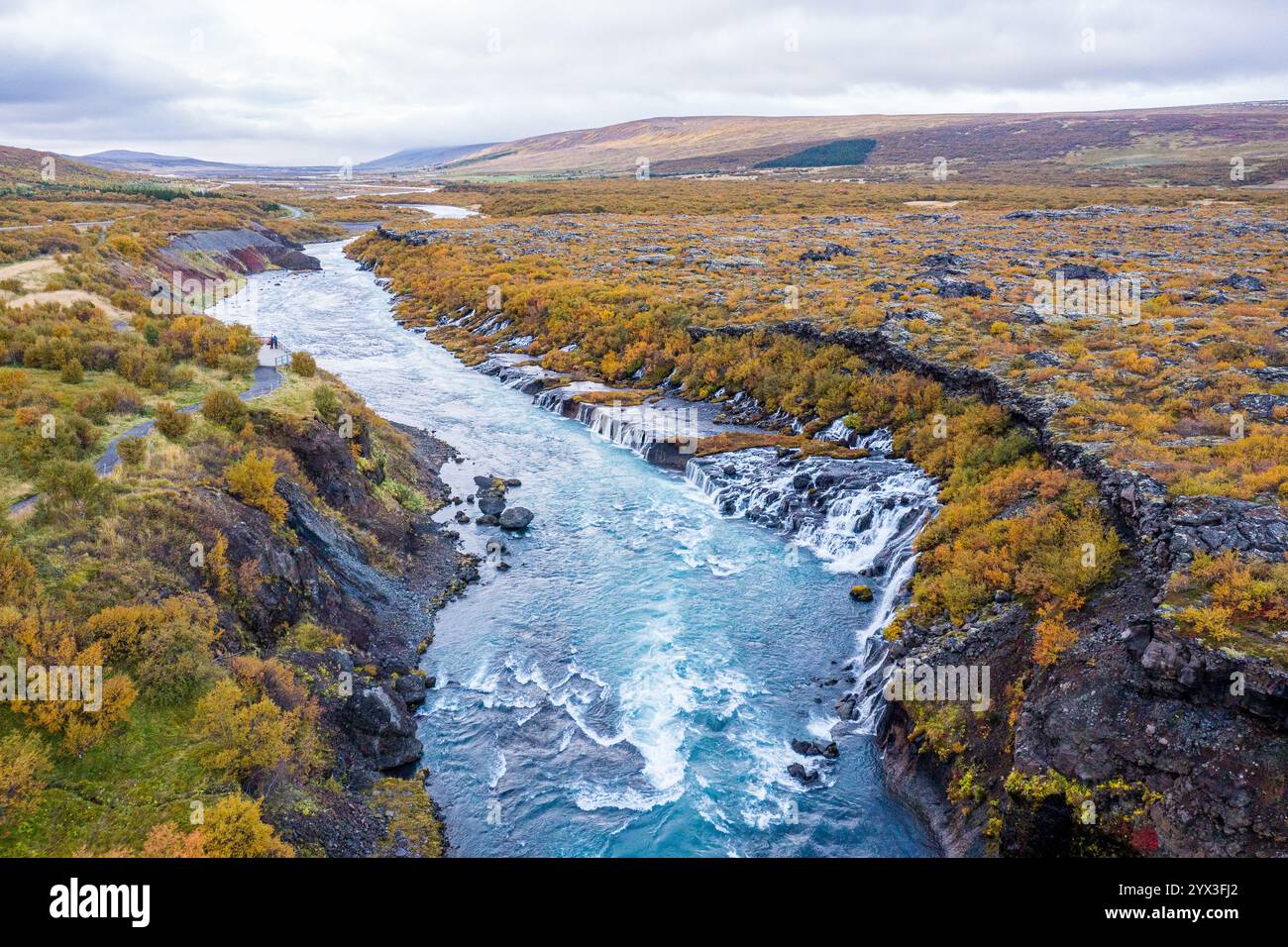 River flows through green valley landscape Stock Photo - Alamy