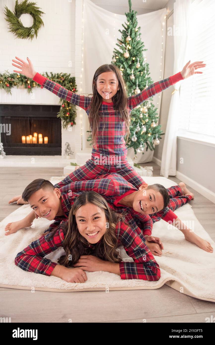 Kids excited doing a dog pile together Stock Photo - Alamy