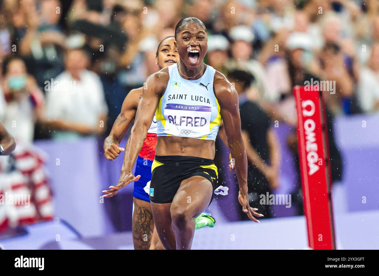 Julien Alfred winning in the 100 meters relay at the Paris 2024 Olympic ...