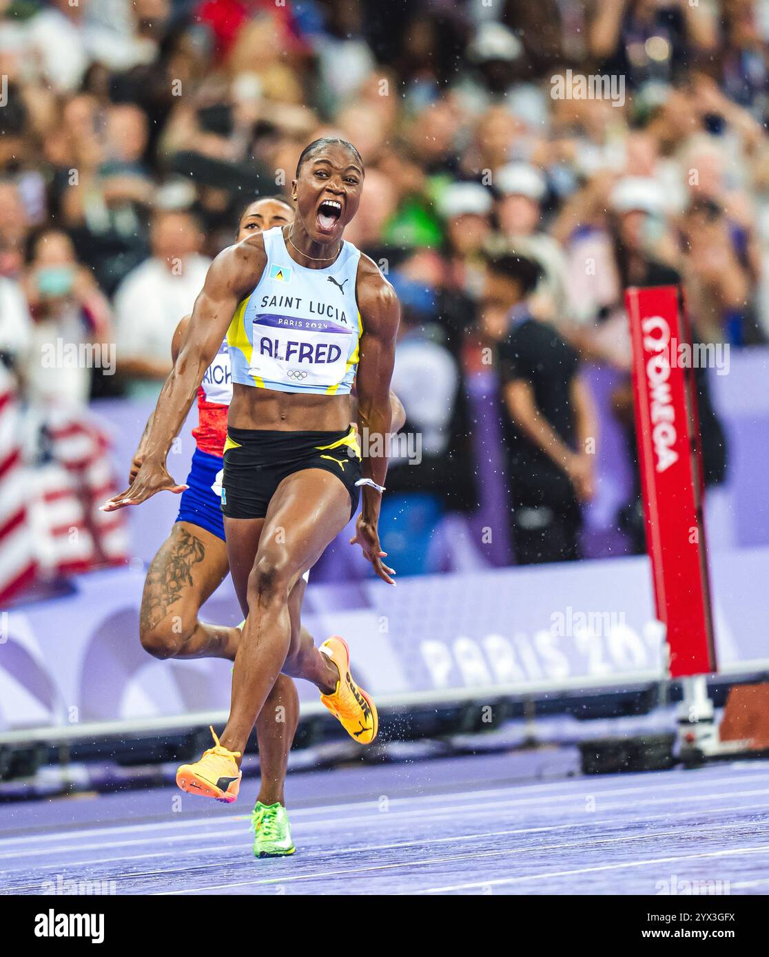 Julien Alfred winning in the 100 meters relay at the Paris 2024 Olympic ...