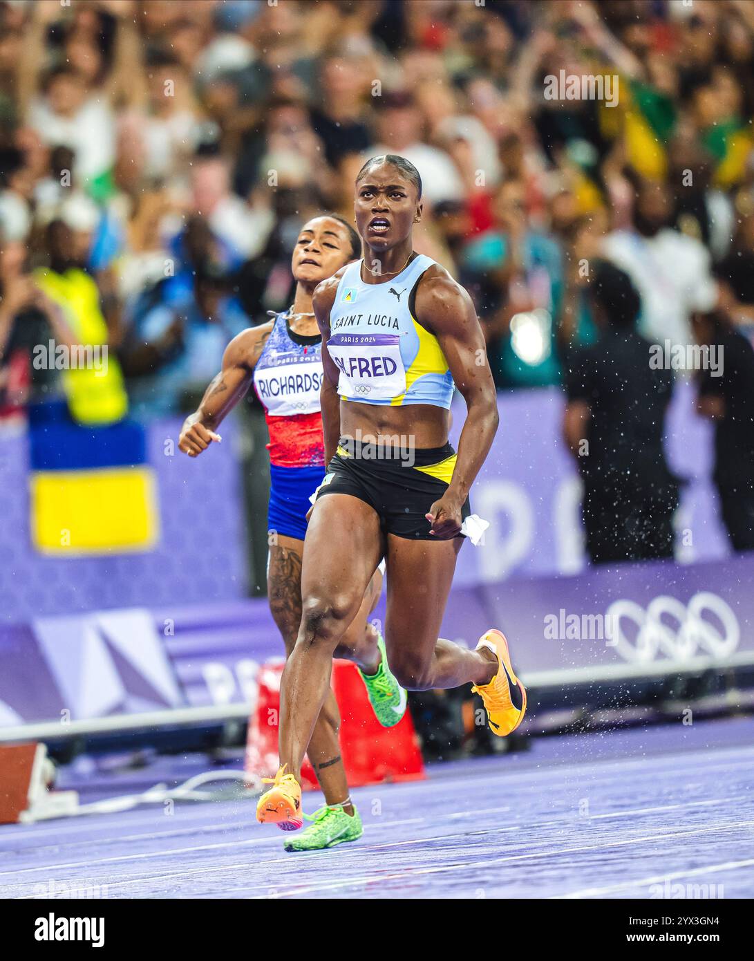 Julien Alfred winning in the 100 meters relay at the Paris 2024 Olympic ...
