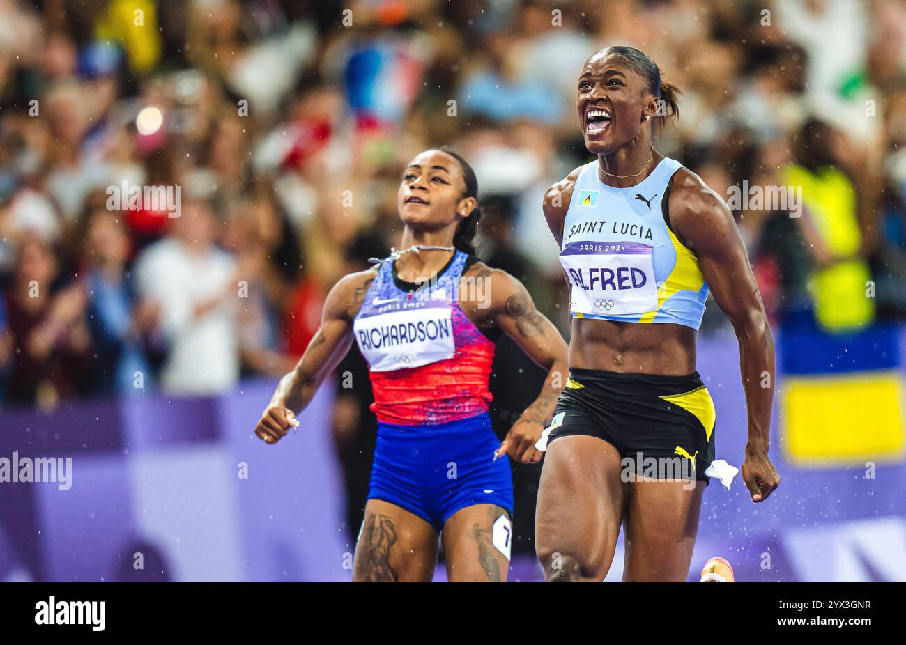 Julien Alfred winning in the 100 meters relay at the Paris 2024 Olympic ...