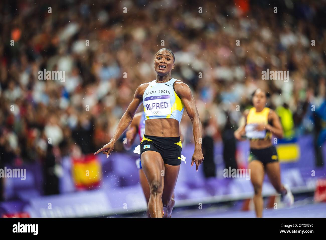 Julien Alfred winning in the 100 meters relay at the Paris 2024 Olympic ...