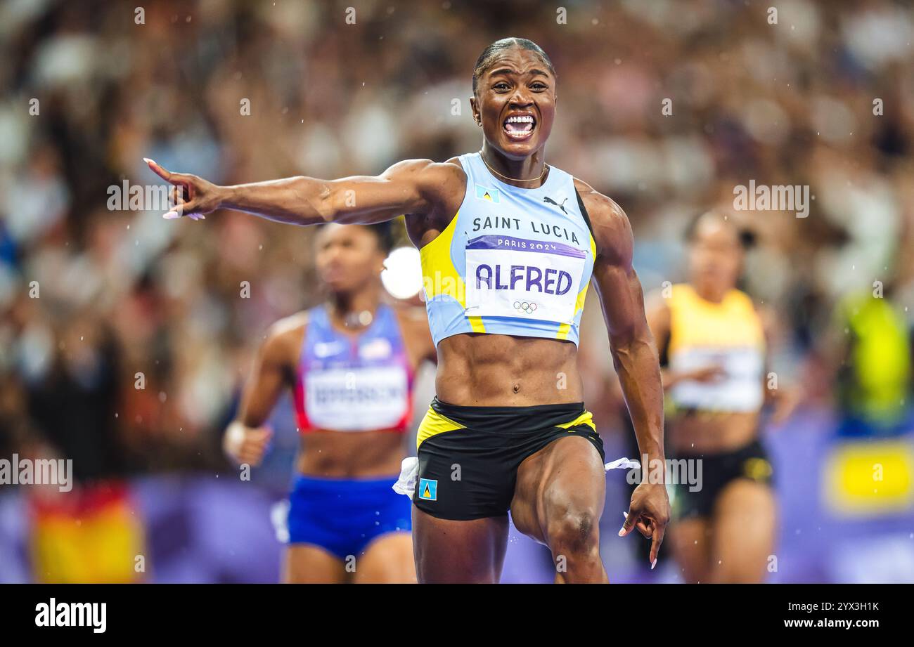 Julien Alfred winning in the 100 meters relay at the Paris 2024 Olympic ...