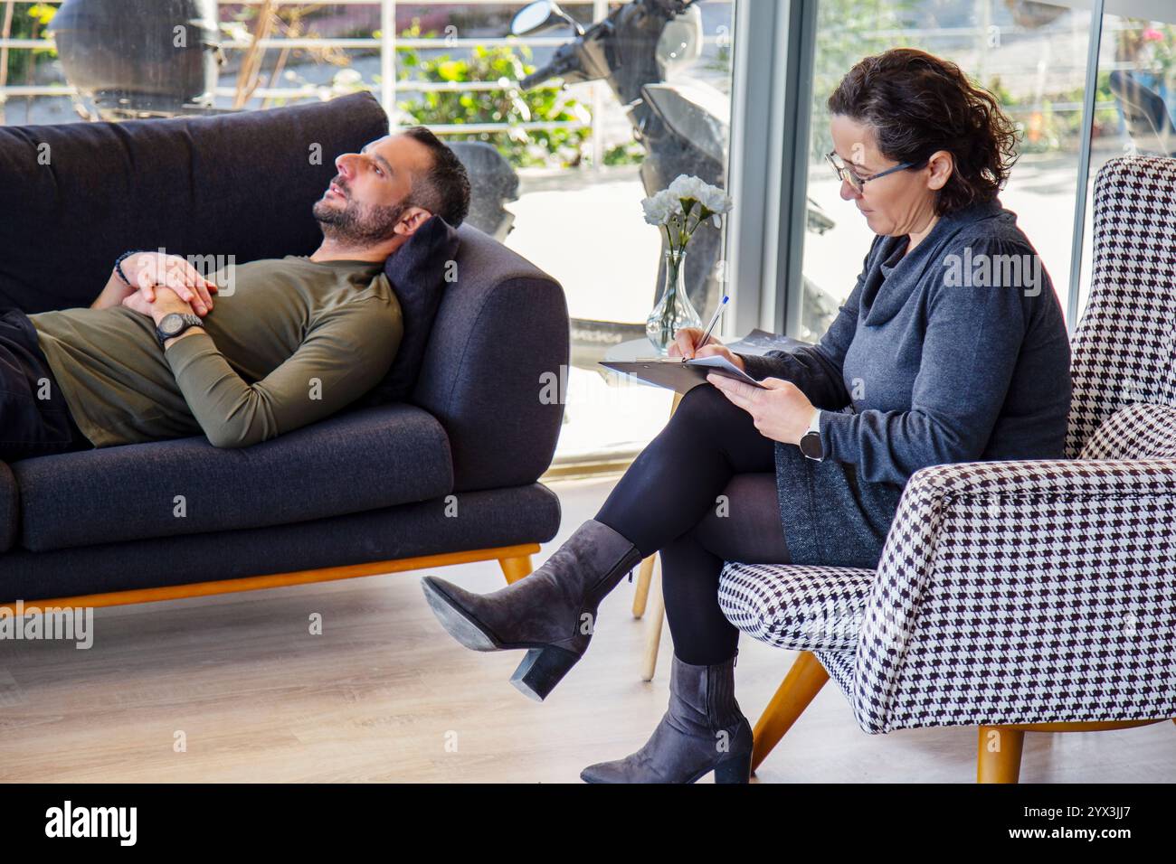 Psychotherapy session, Therapist and client in conversation Stock Photo ...