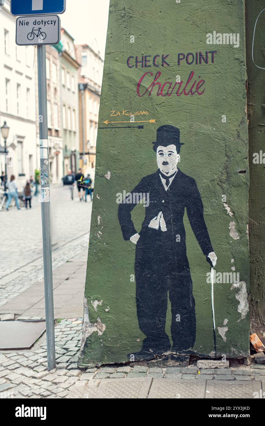 Street art in Poznań depicting Checkpoint Charlie, showcasing urban ...