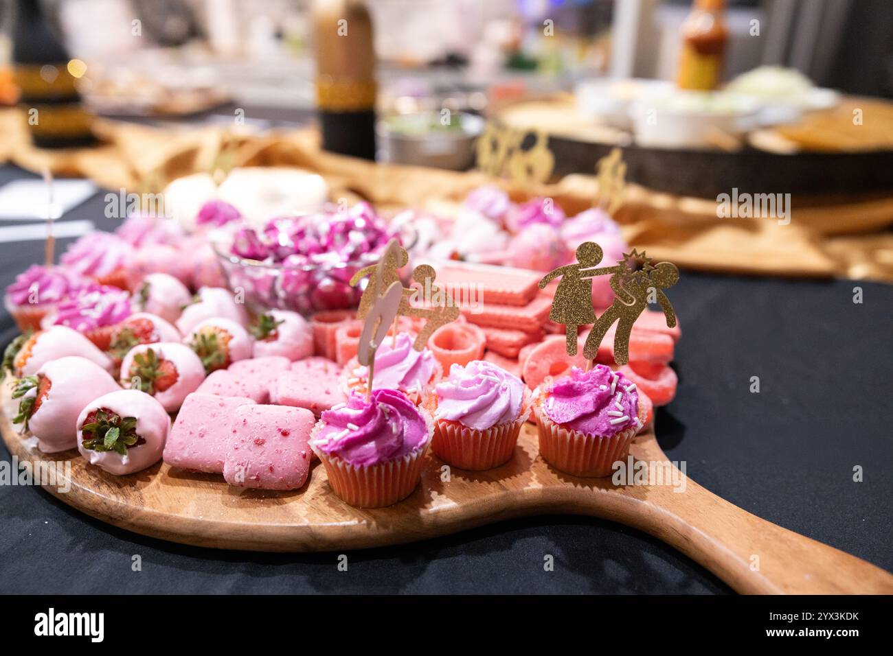 dessert board with pink treats and custom toppers for a divorce party ...