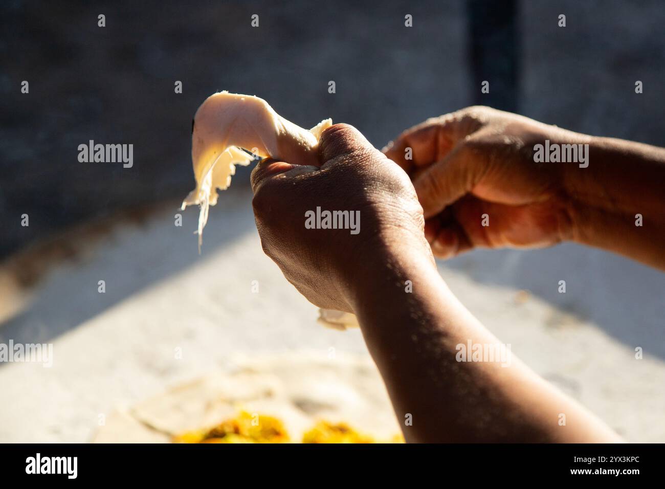 Cooking traditional squash blossom quesadillas on a comal in the Oaxaca ...