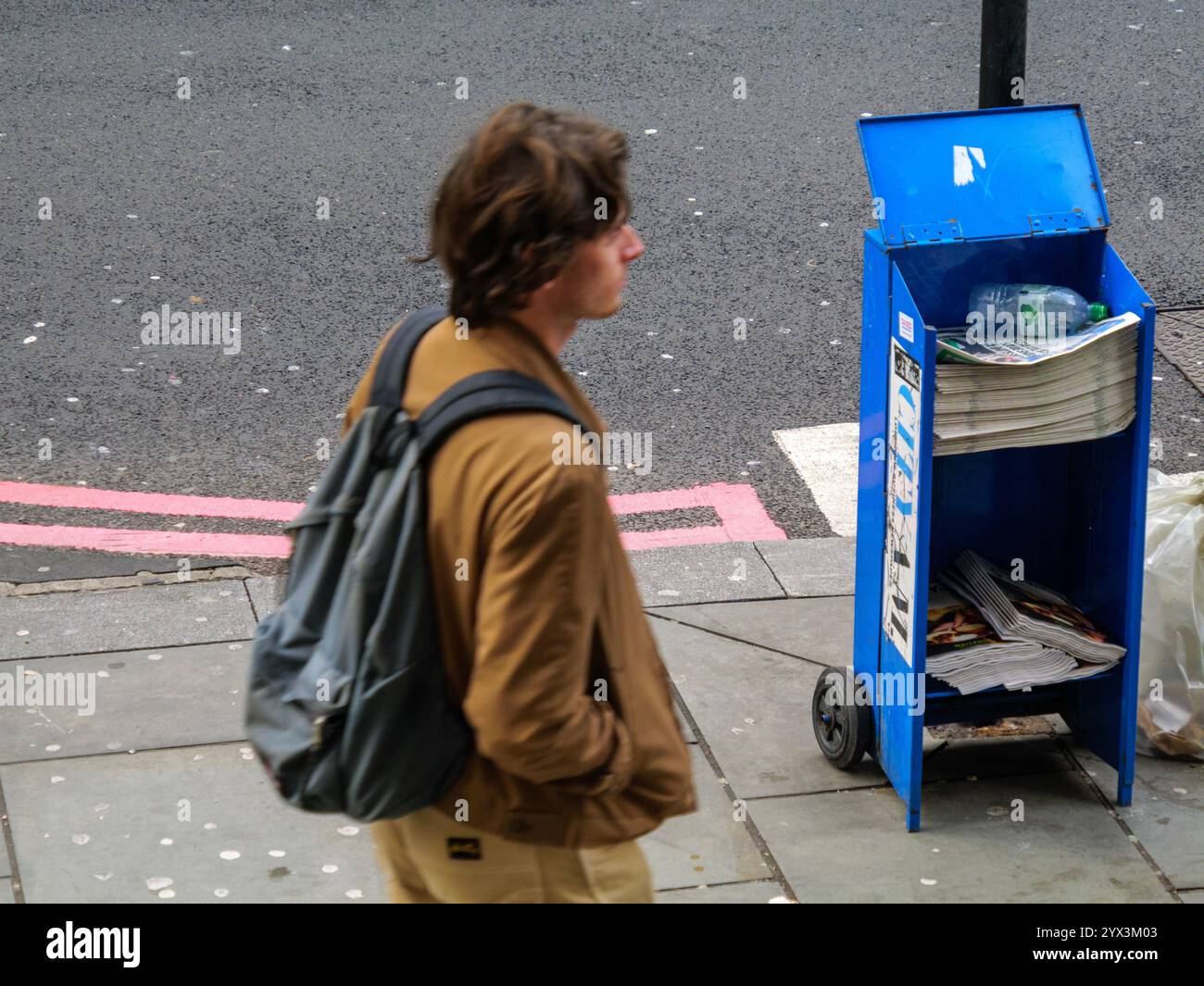 City AM free newspaper bin, London, with passing pedestrian, London, UK ...