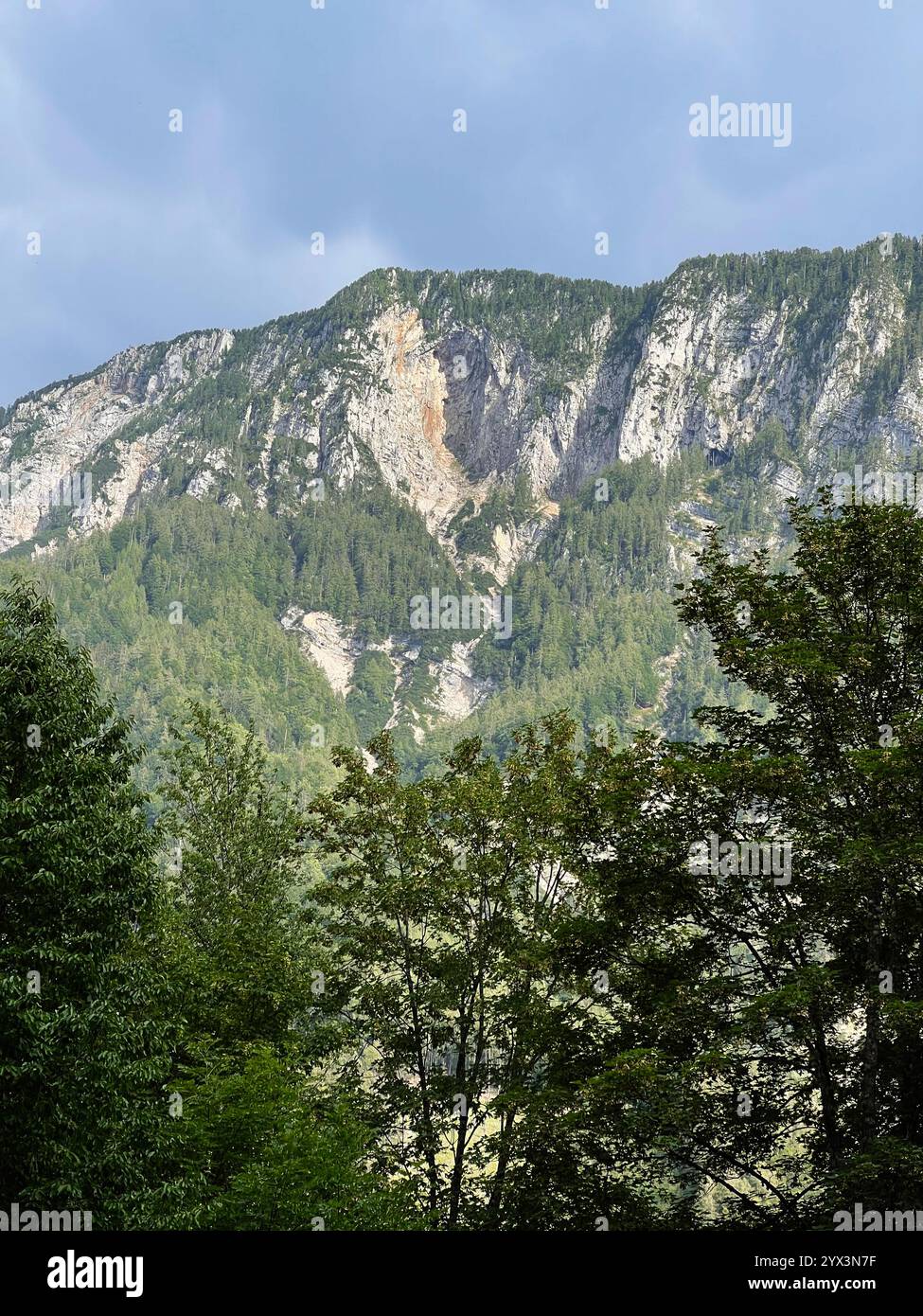 This image captures a breathtaking mountain landscape featuring rugged ...