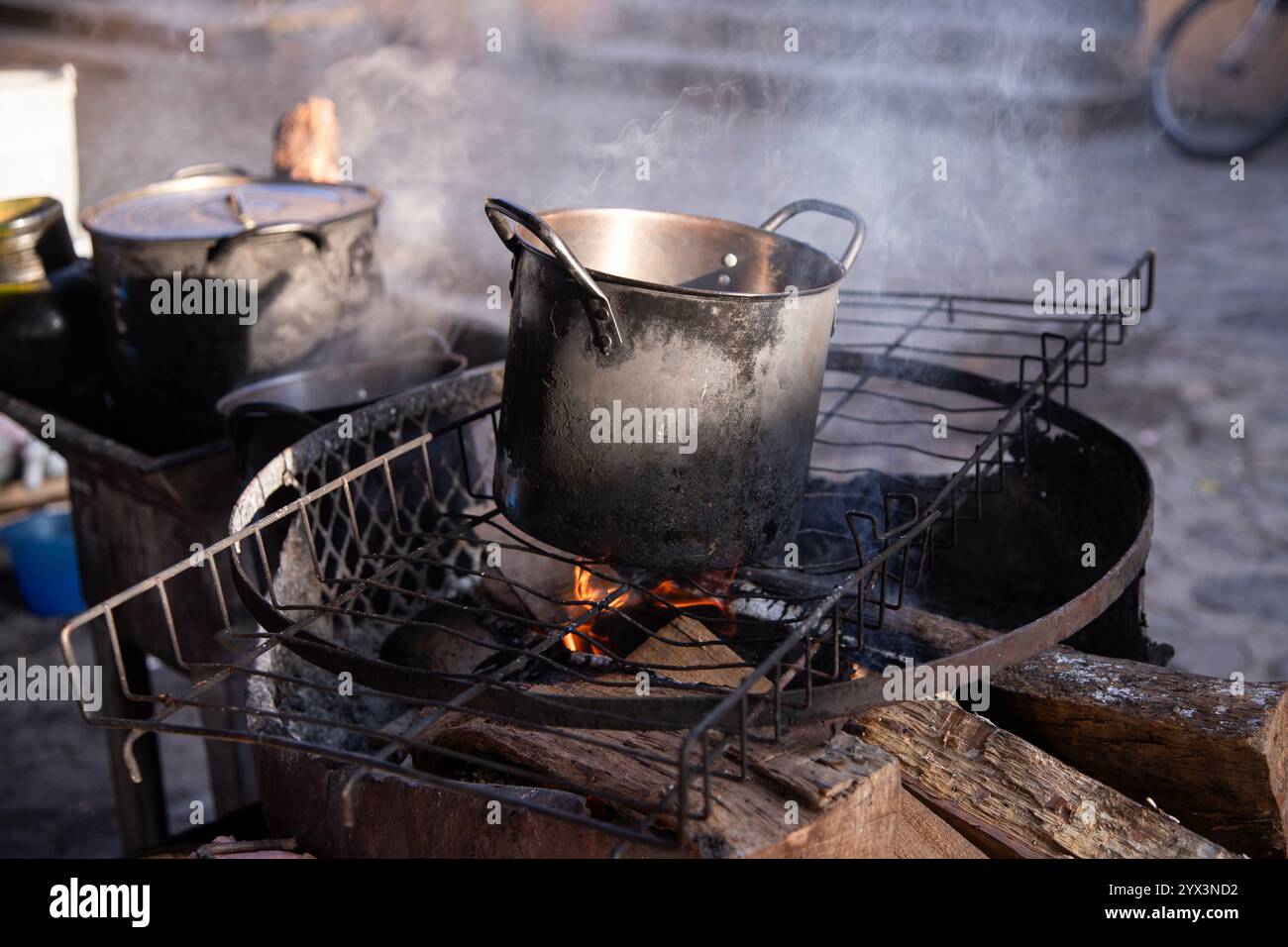 Clay and iron pots at a street food stand in Oaxaca cooking traditional ...